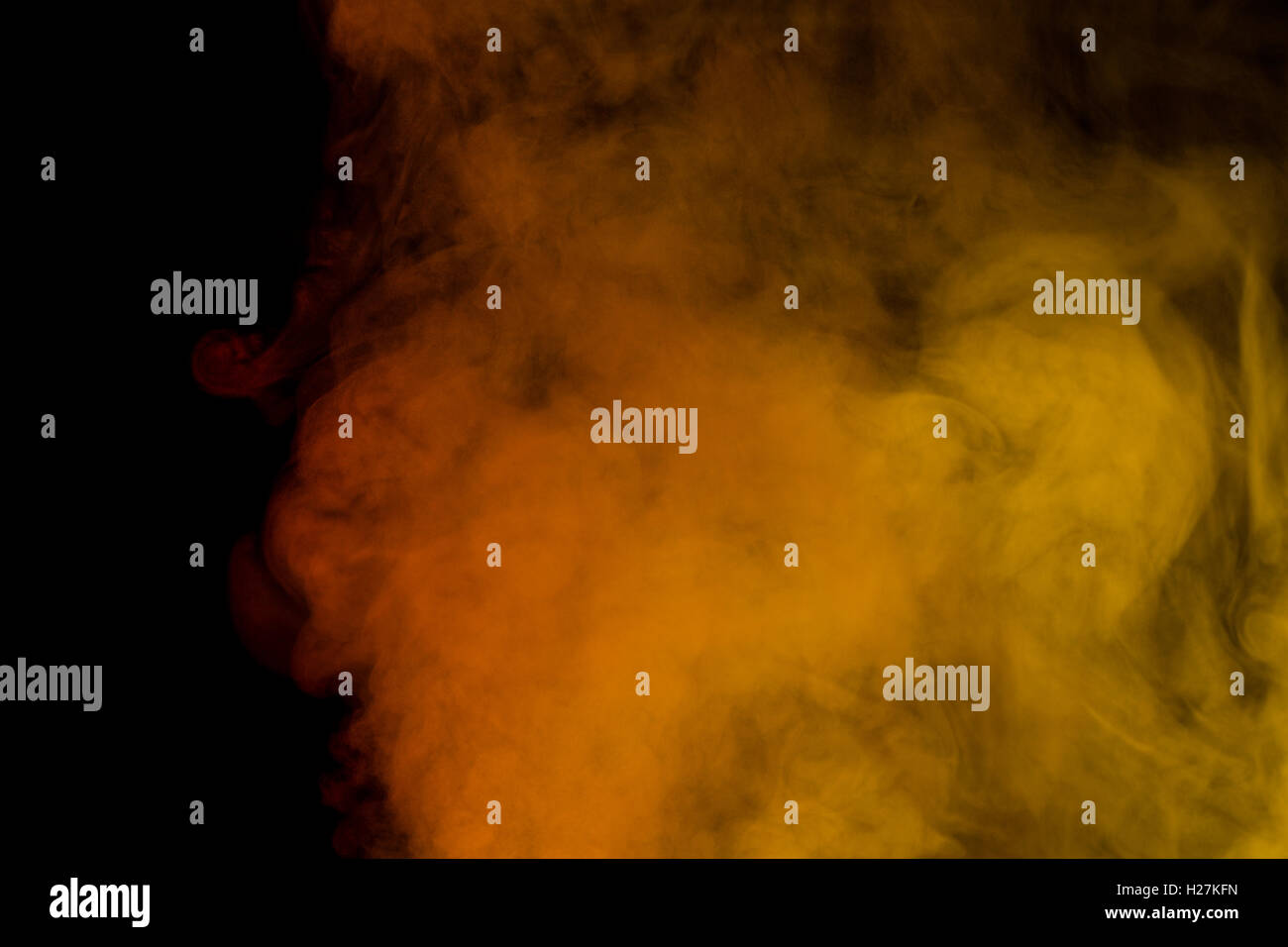 Abstract red yellow water vapor on a black background. Texture. Design ...