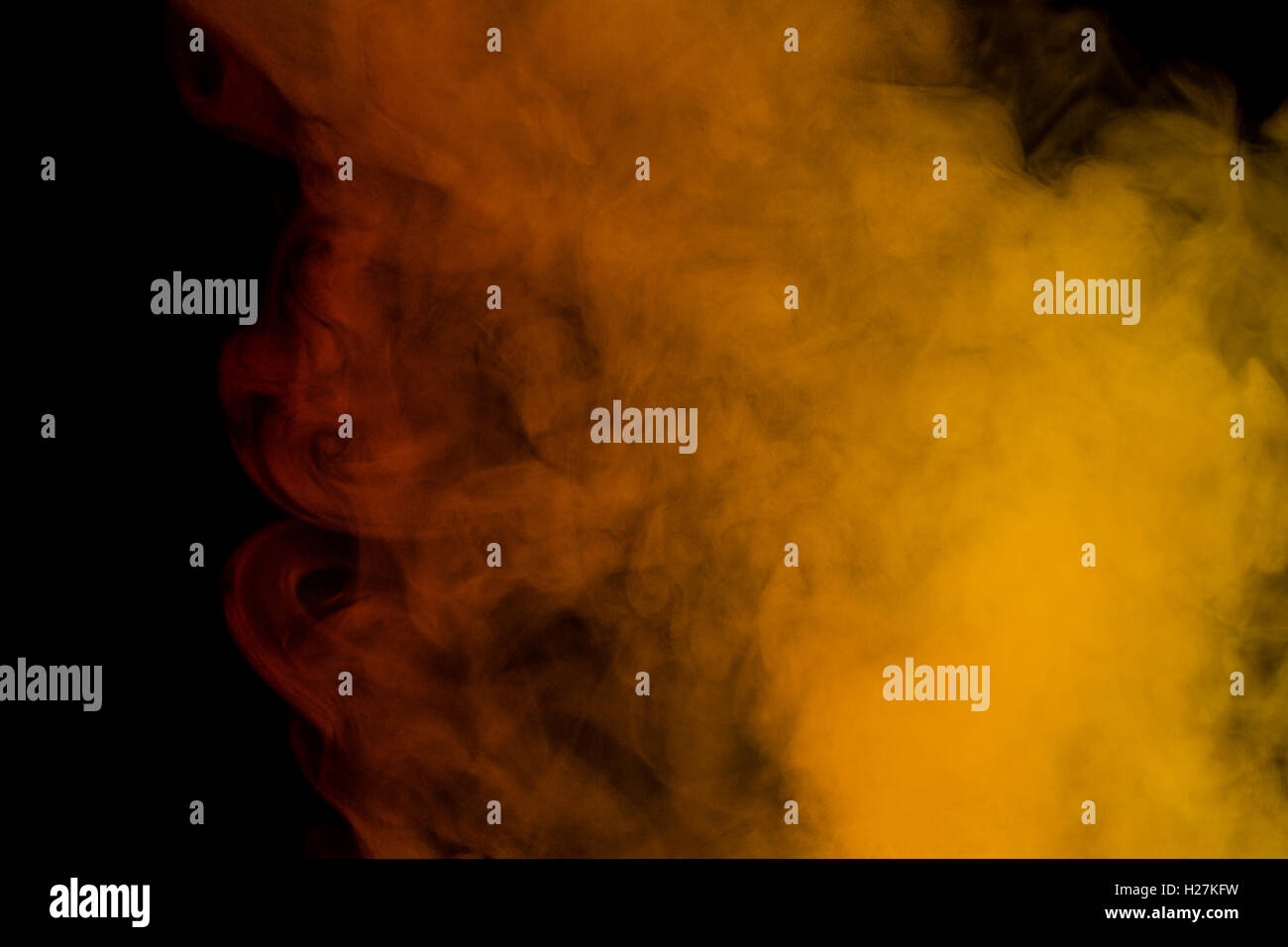 Abstract red yellow water vapor on a black background. Texture. Design ...