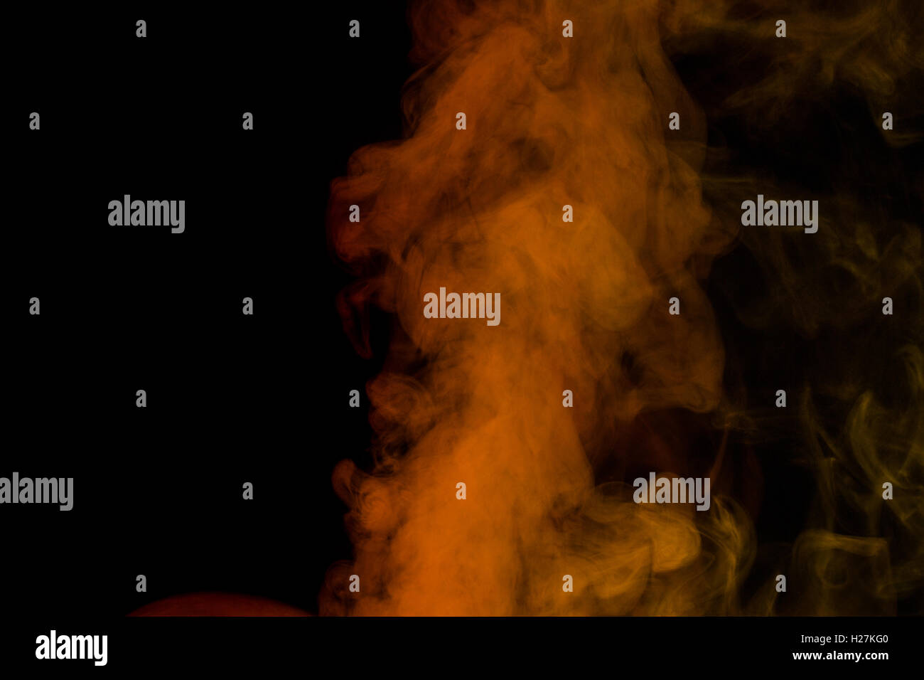 Abstract red yellow water vapor on a black background. Texture. Design ...