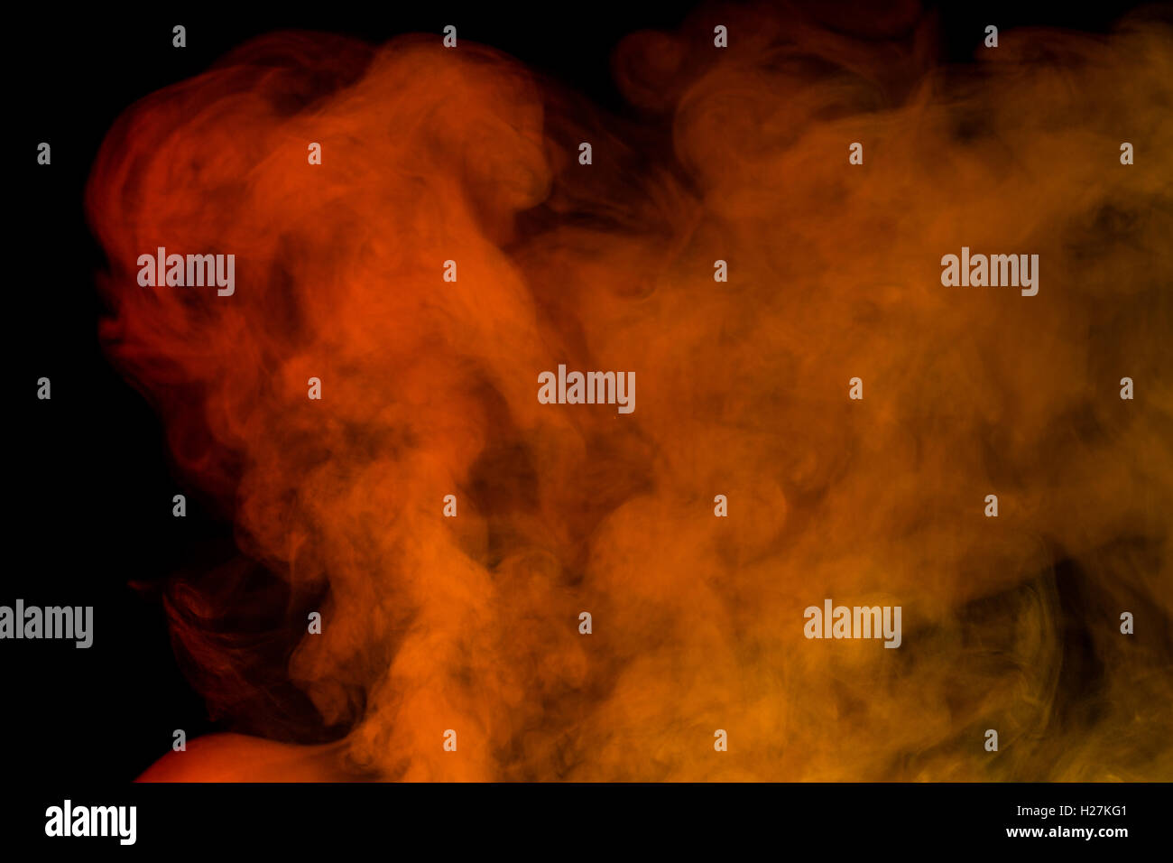 Abstract red yellow water vapor on a black background. Texture. Design ...
