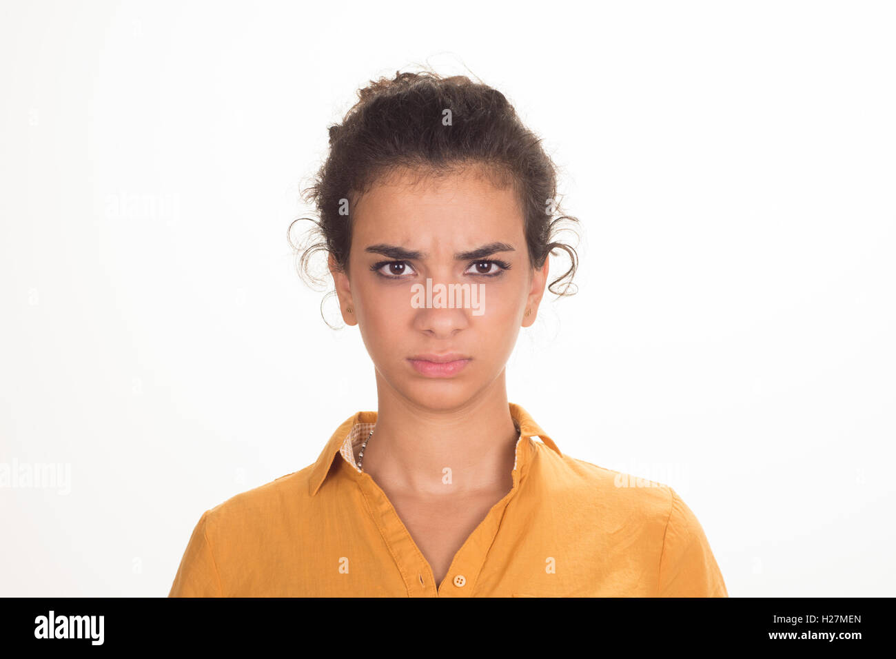 Annoyed young woman frowning Stock Photo - Alamy