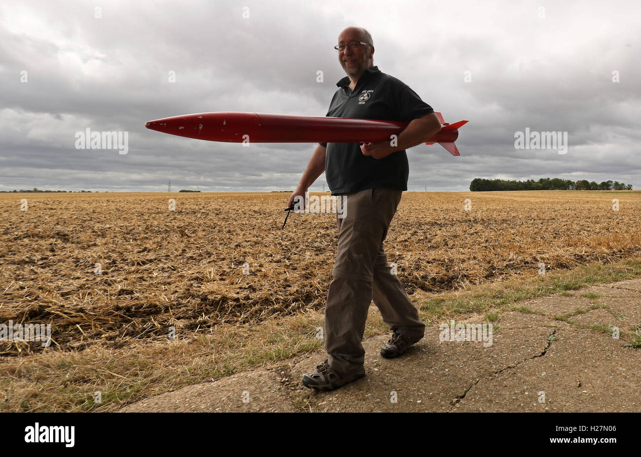 Rod Stevenson, chairman of the East Anglian Rocketry Society, carries a ...