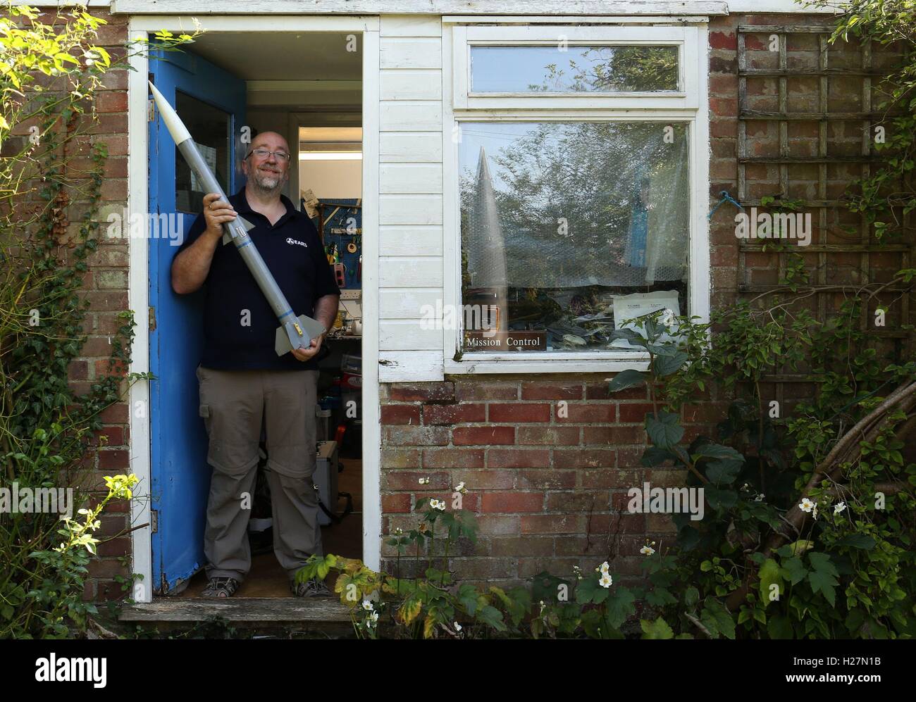 Rod Stevenson, chairman of the East Anglian Rocketry Society, holds a ...