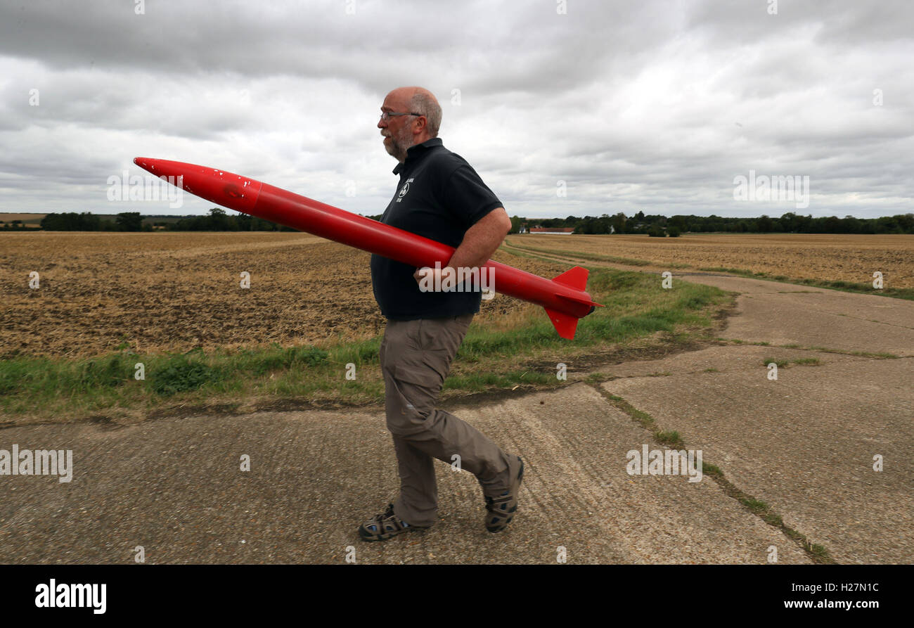 Rod Stevenson, chairman of the East Anglian Rocketry Society, carries a ...