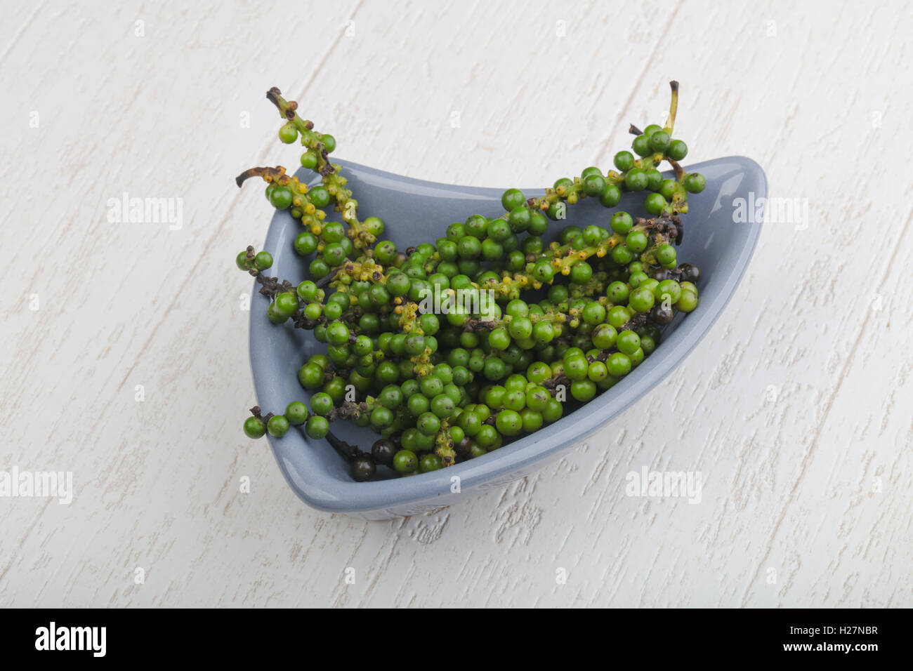 Green pepper corn on the branch in plate Stock Photo - Alamy