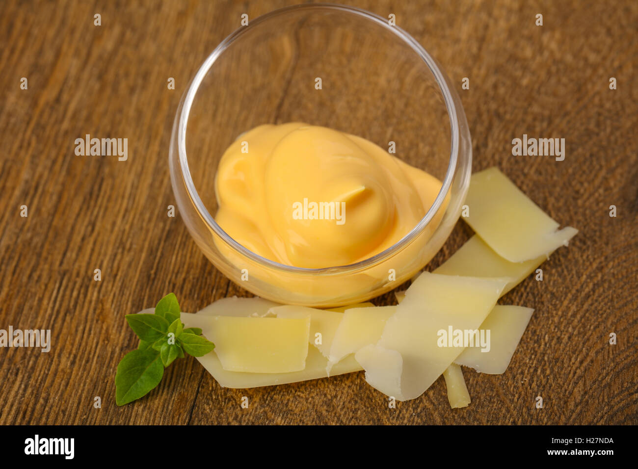 Cheese sauce with sliced parmesan and basil leaves Stock Photo - Alamy