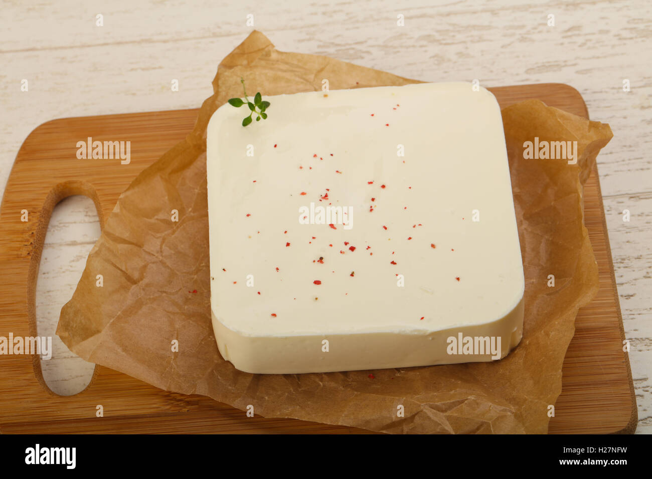 Traditional Feta cheese on the wooden background Stock Photo - Alamy