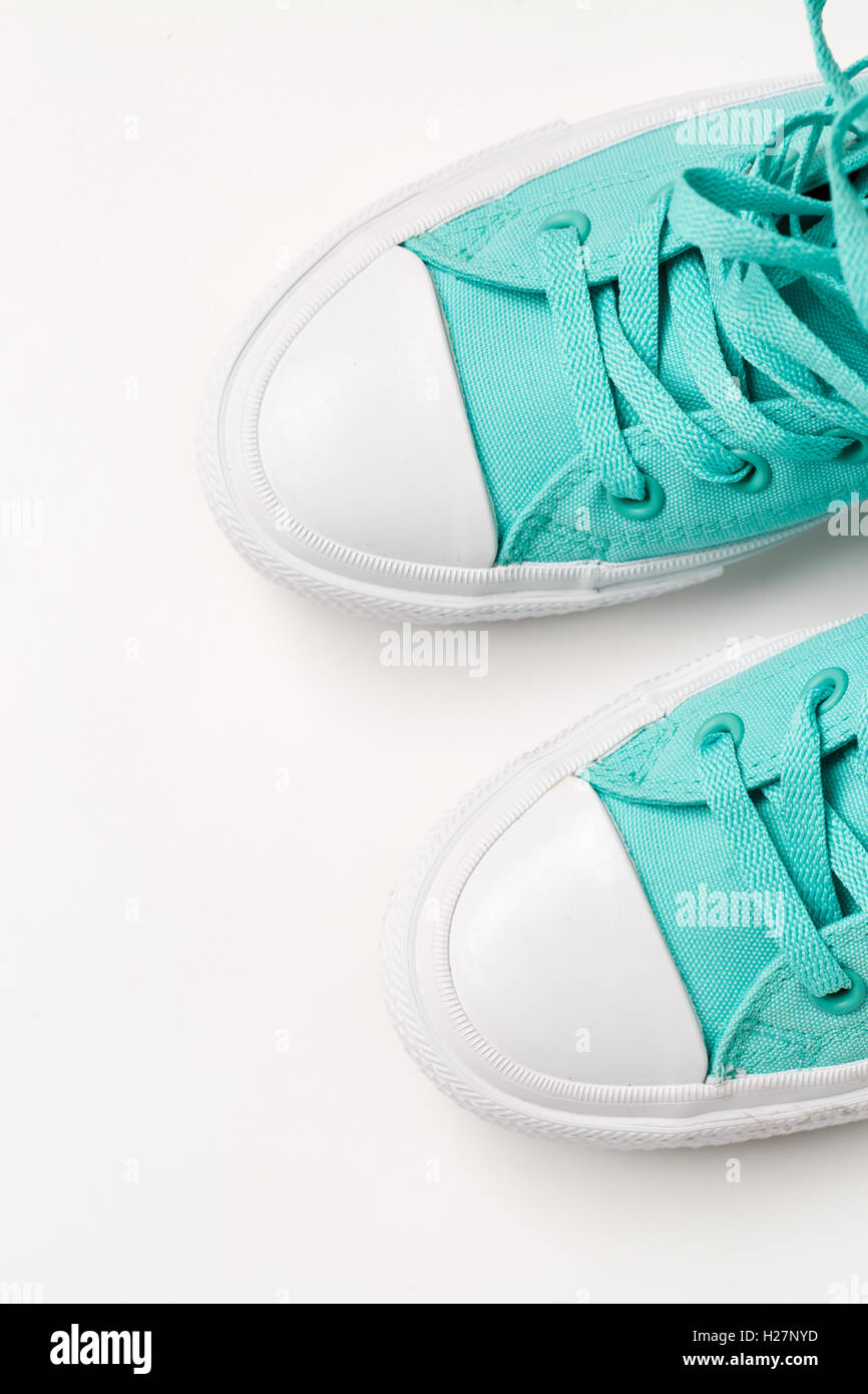 Top view of sneakers on white background Stock Photo - Alamy