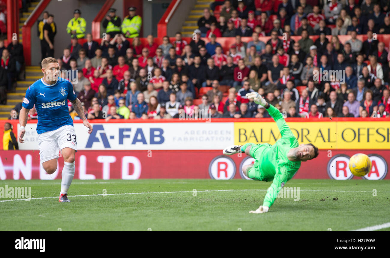 Aberdeen's Joe Lewis saves from Rangers' Martyn Waghorn (left) during ...
