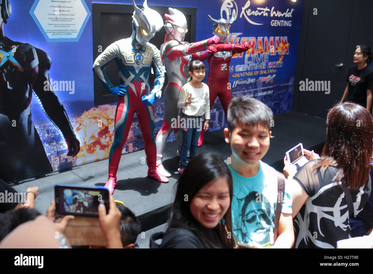 Family taking photos at Ultraman meet and greet session at Toyko Street ...