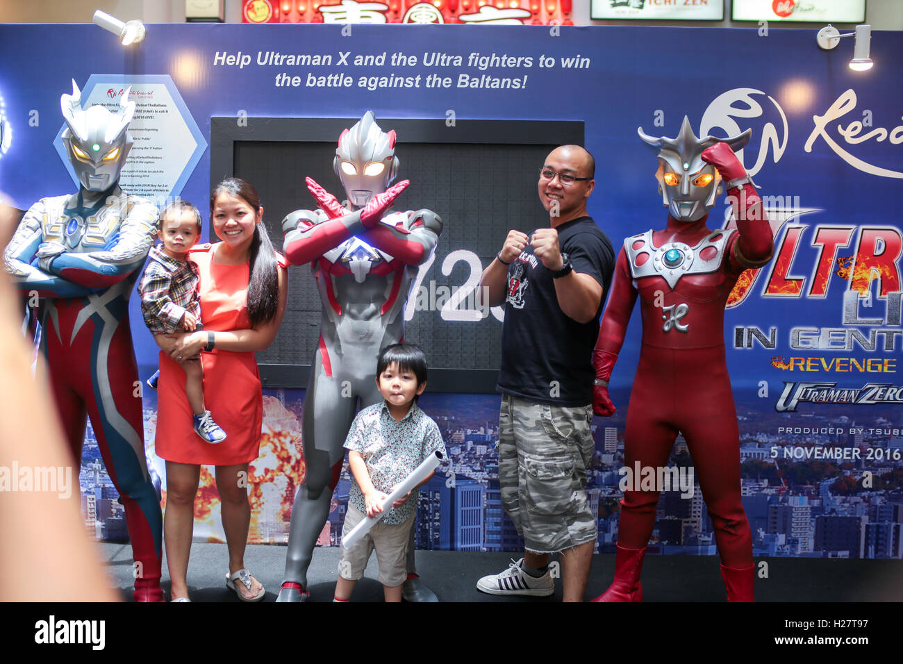 Family taking photos at Ultraman meet and greet session at Toyko Street ...