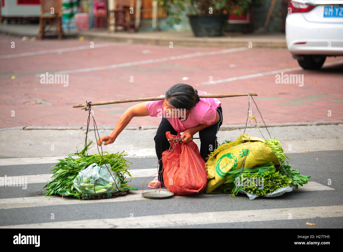 Shoulder carrying pole china hi-res stock photography and images - Alamy