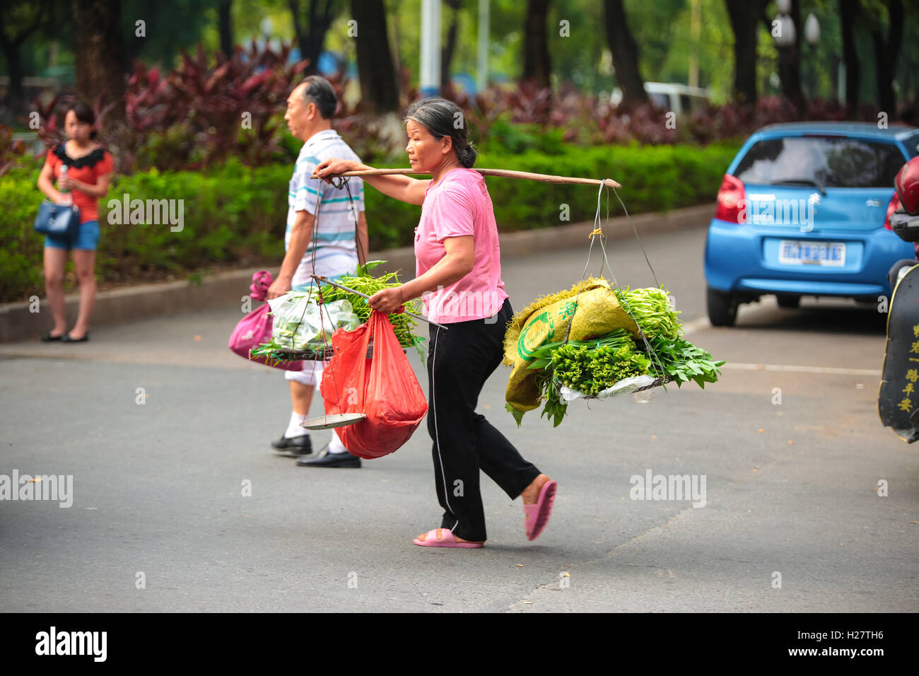 Shoulder carrying pole china hi-res stock photography and images - Alamy