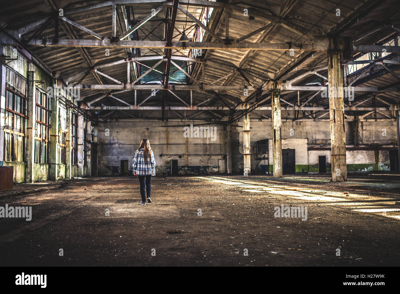 Little Girl in Empty Factory Stock Photo - Alamy