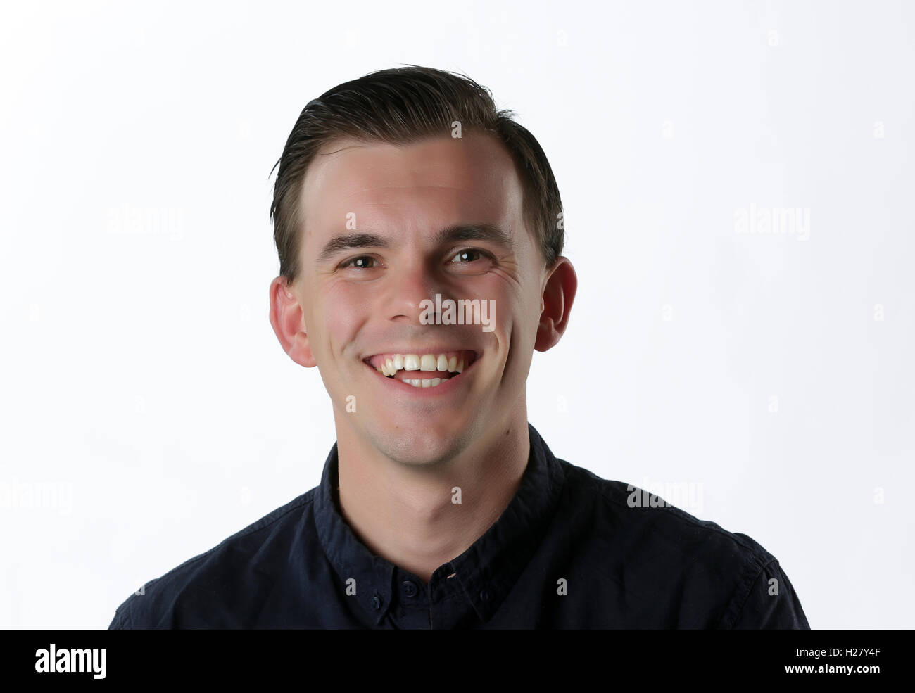 Portrait of a handsome man looking very happy Stock Photo - Alamy
