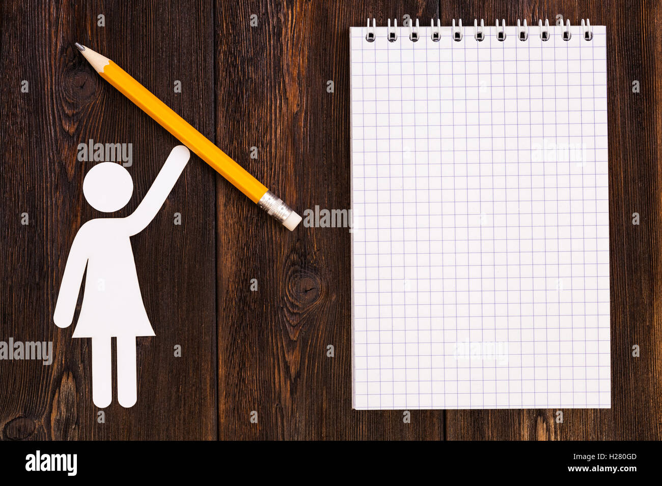 Paper woman with pencil and blank notebook. Abstract conceptual image ...