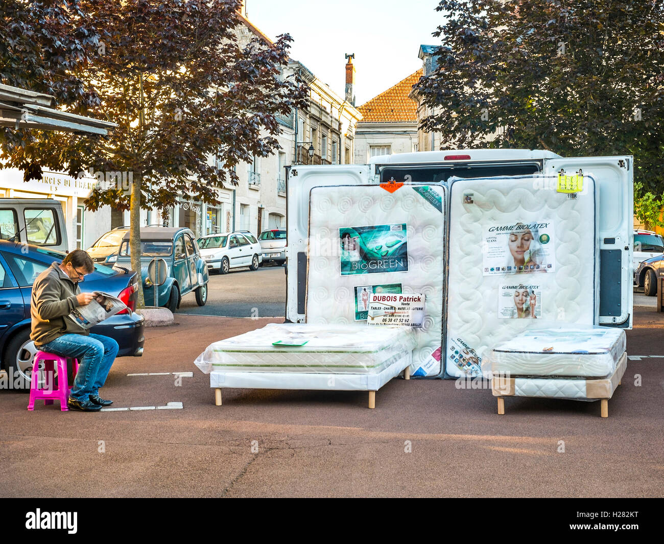 Man at street market selling bed mattresses - France Stock Photo - Alamy