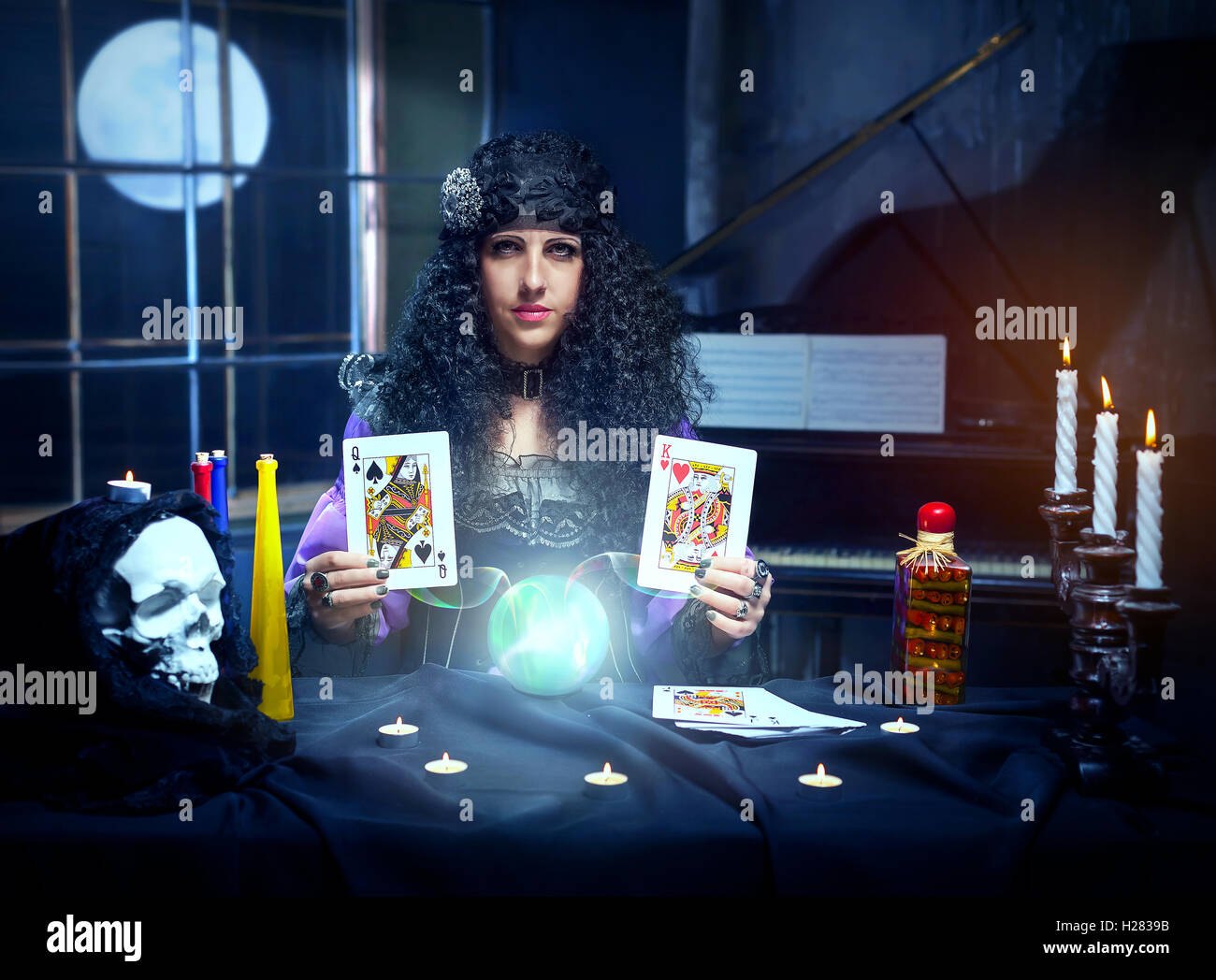 Sorceress while practising witchcraft Stock Photo - Alamy