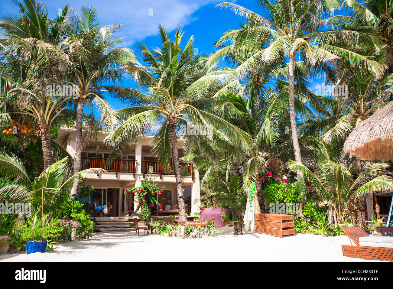 Cozy little hotel on a tropical exotic resort at white sandy beach ...