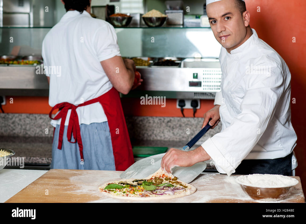Chef busy in preparing pizza Stock Photo - Alamy