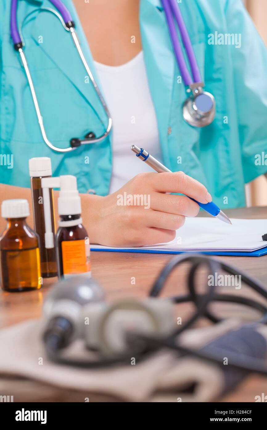 Female doctor using sphygmomanometer hi-res stock photography and ...