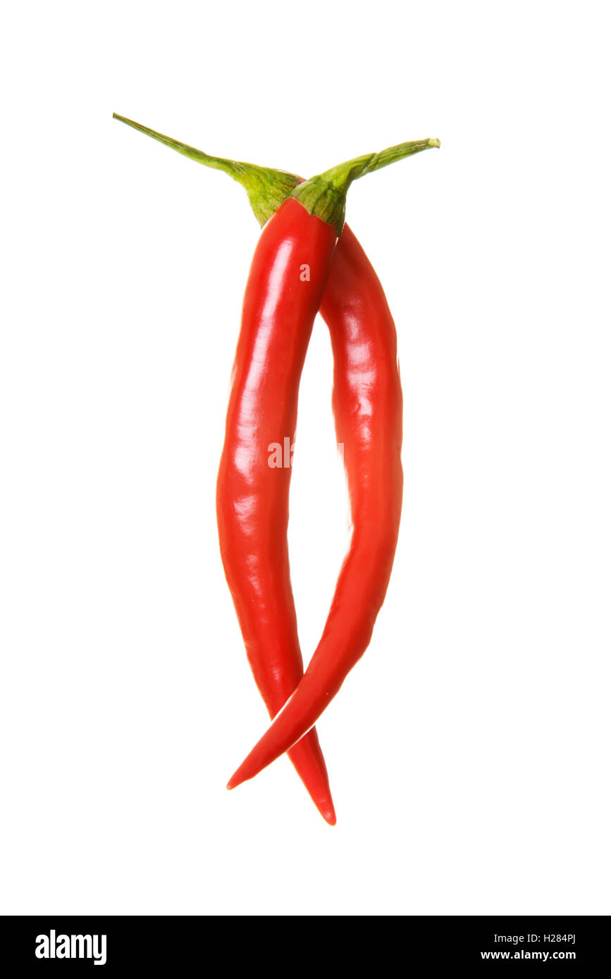 Two red chili peppers Stock Photo - Alamy