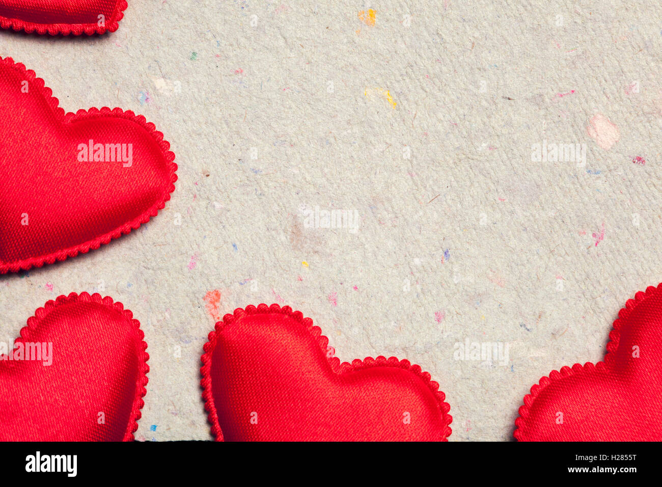 red hearts on vintage paper background Stock Photo - Alamy