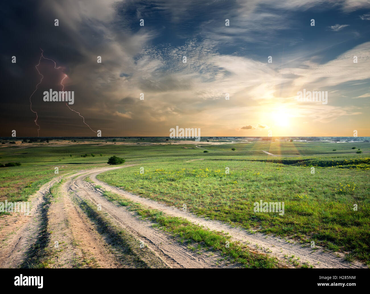 Storm over the road in field Stock Photo - Alamy