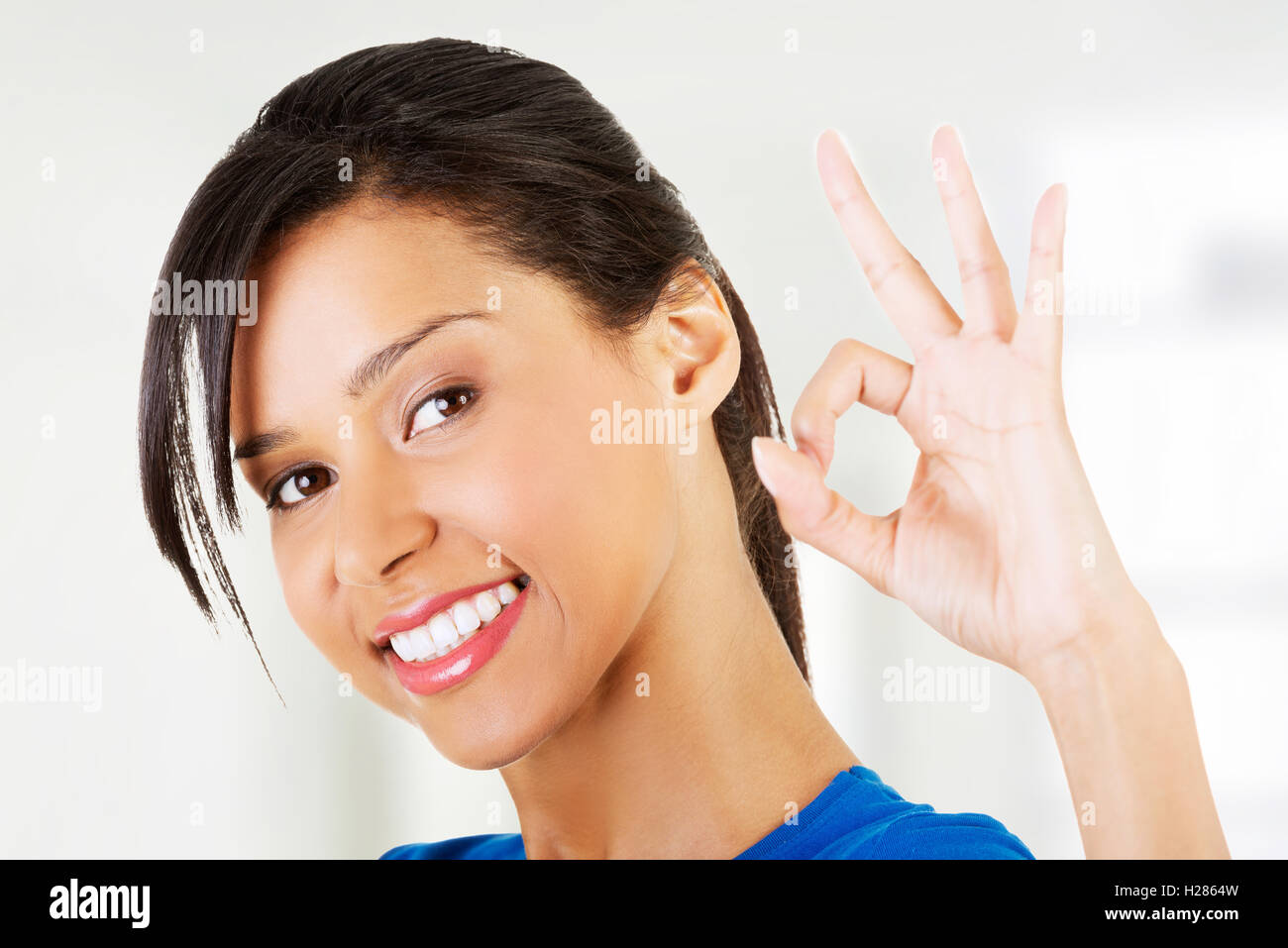 Happy student girl gesturing perfect Stock Photo - Alamy
