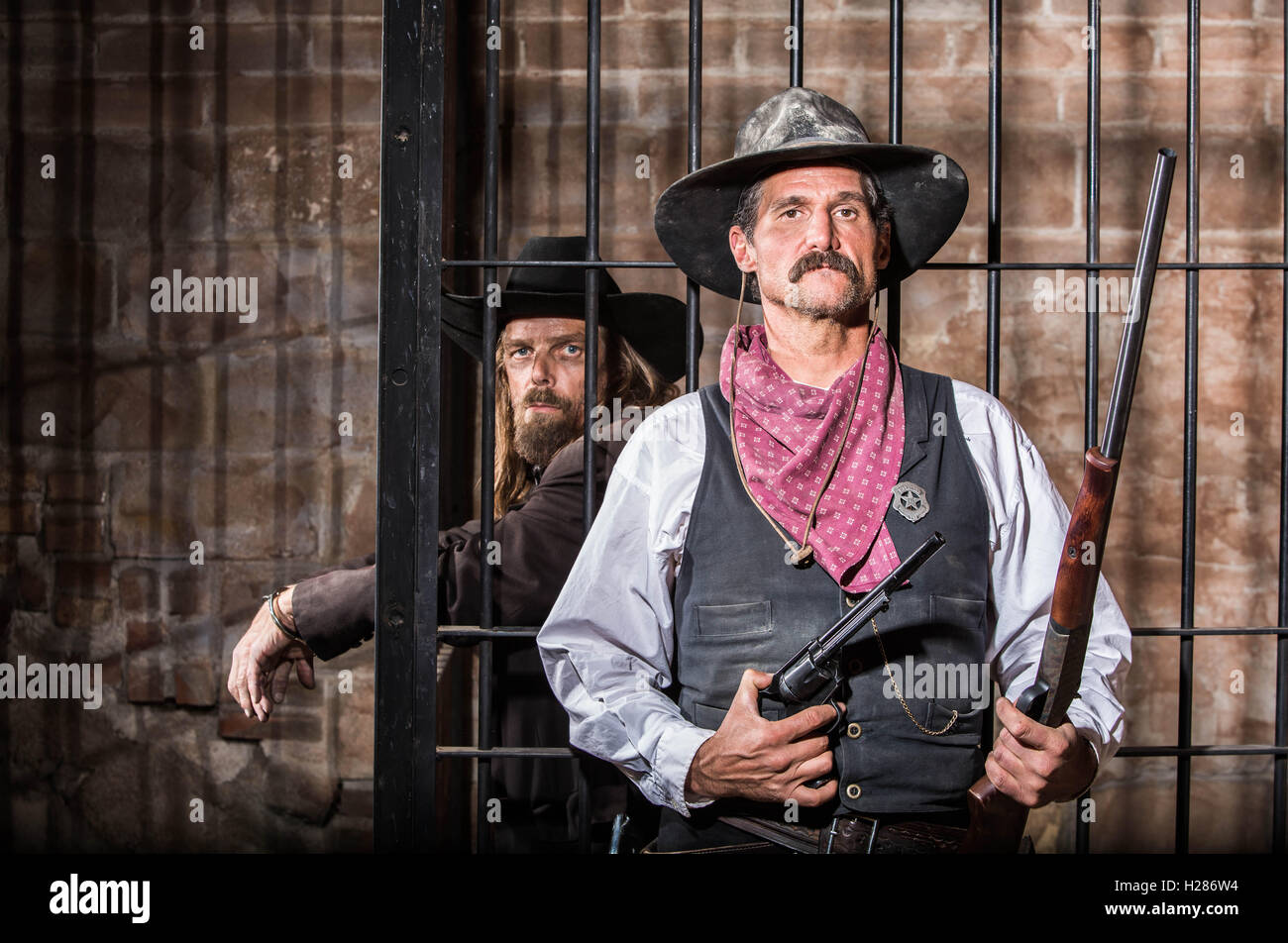 Sheriff Poses With Prisoner Stock Photo - Alamy