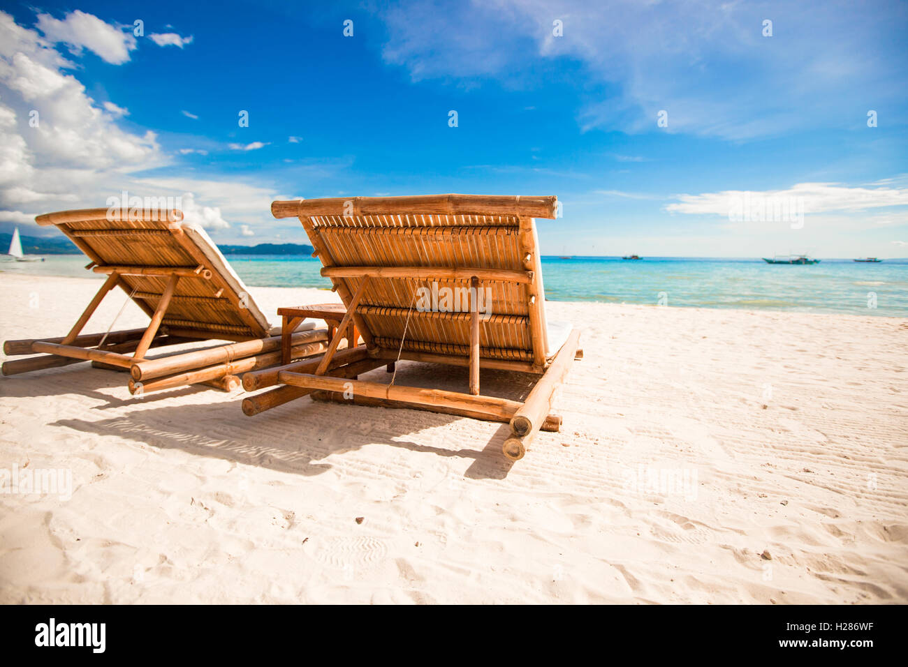 Paradise view of nice tropical empty sandy plage with umbrella and ...