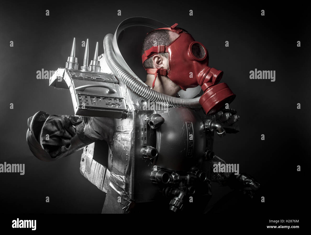 Astronaut with red gas mask on a black background with huge weap Stock ...