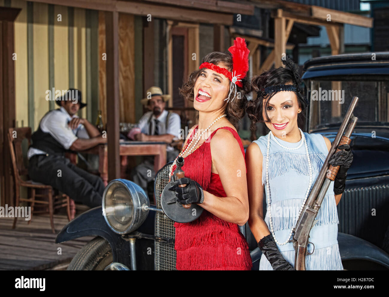 Laughing Female Gangsters Stock Photo - Alamy