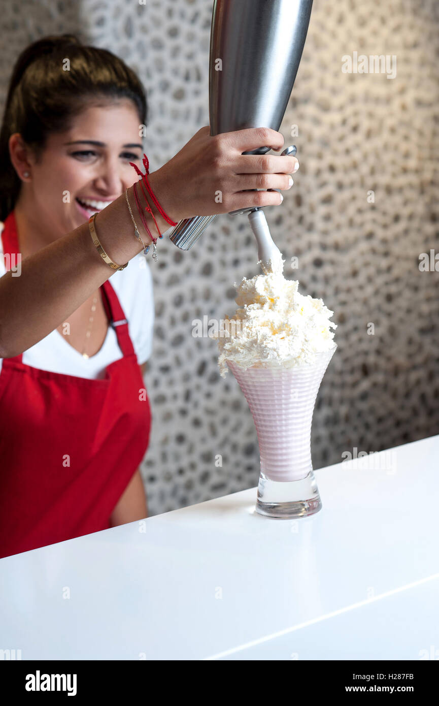 Woman preparing thick shake Stock Photo - Alamy