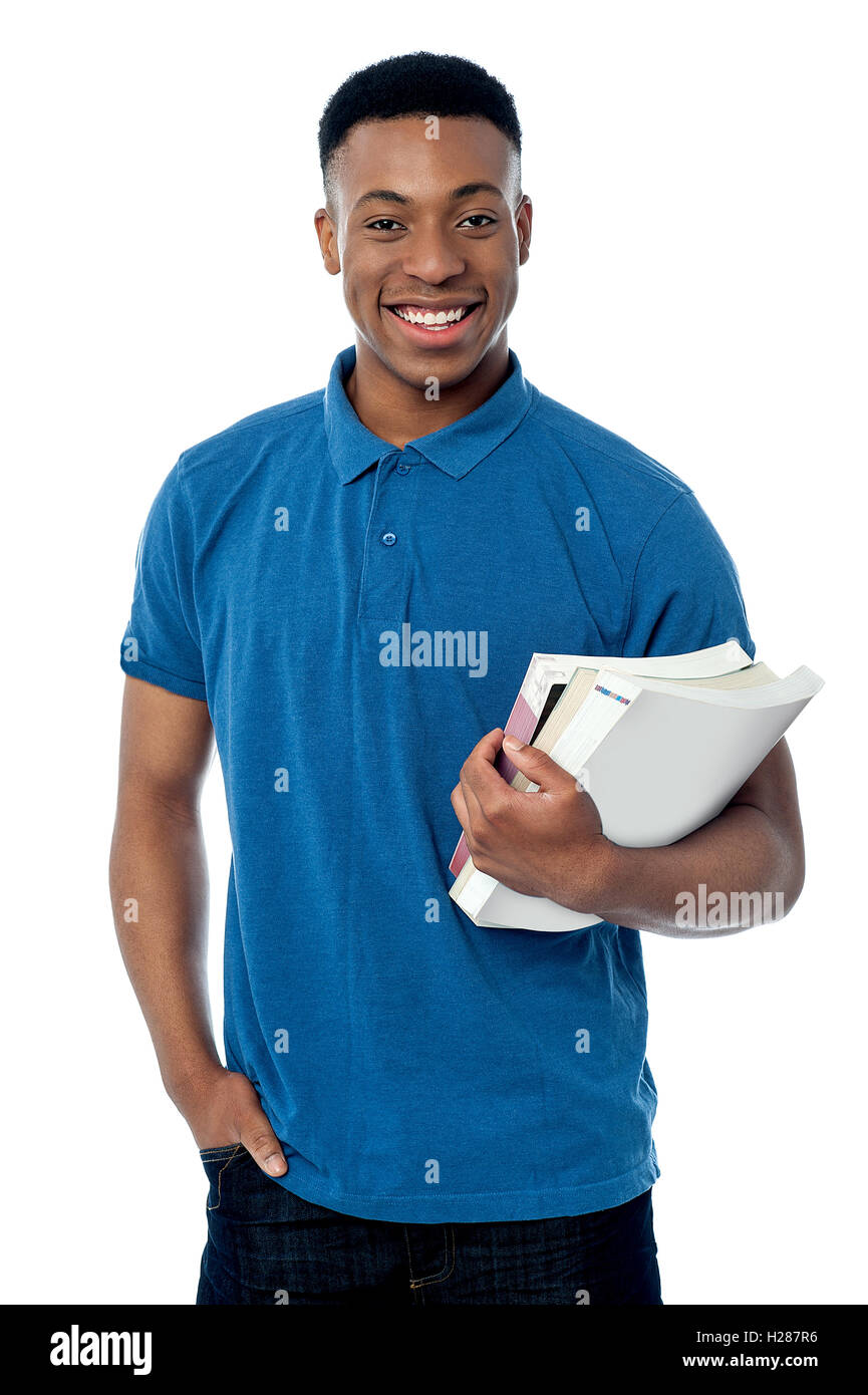 Smiling young guy books hi-res stock photography and images - Alamy