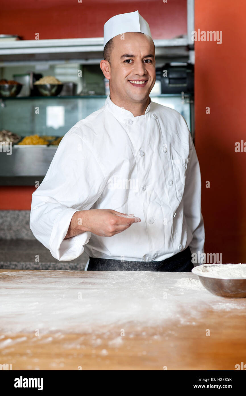Male chef working in kitchen Stock Photo - Alamy