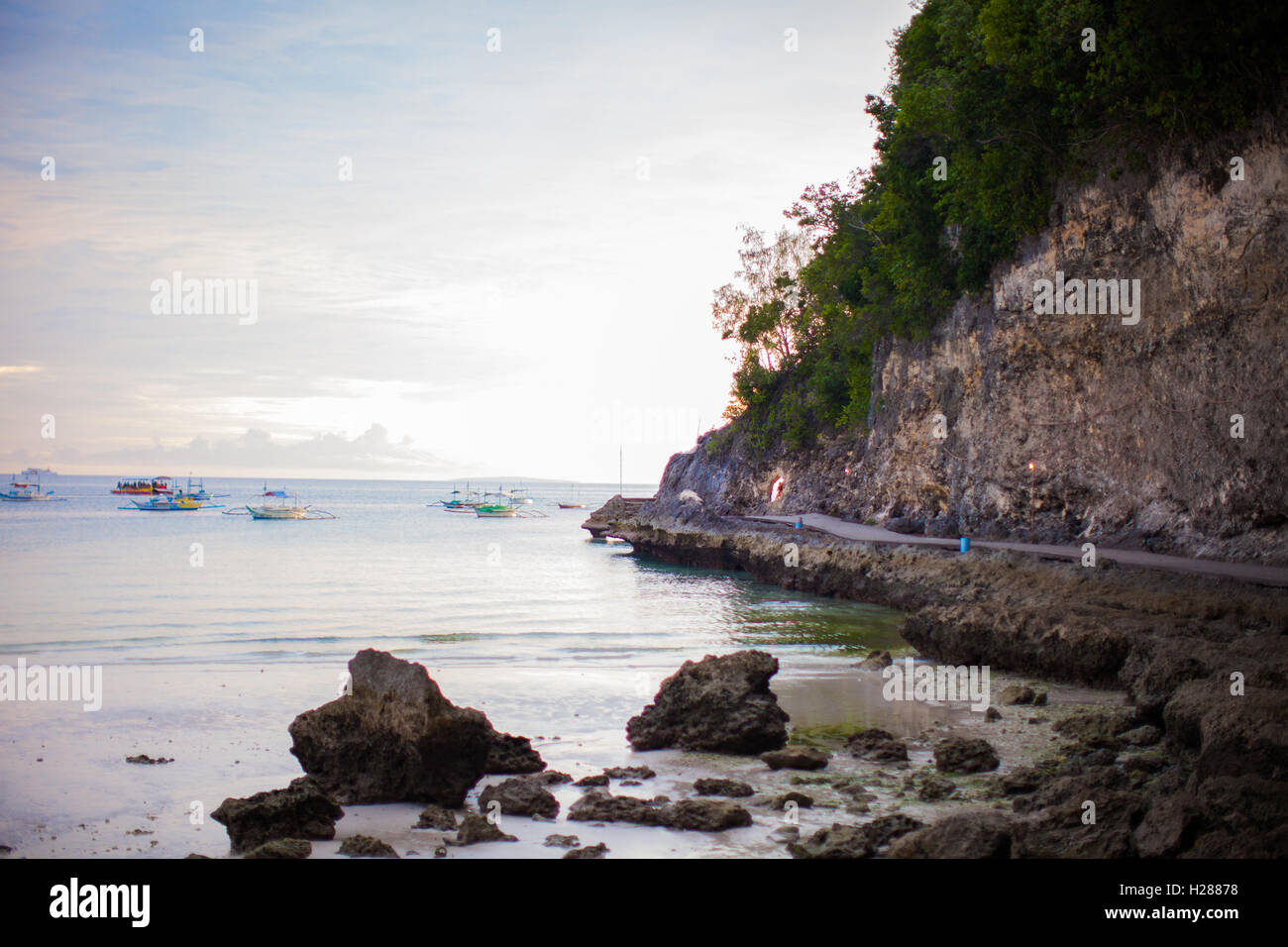 Tropical beach at sunset on an exotic island Stock Photo - Alamy