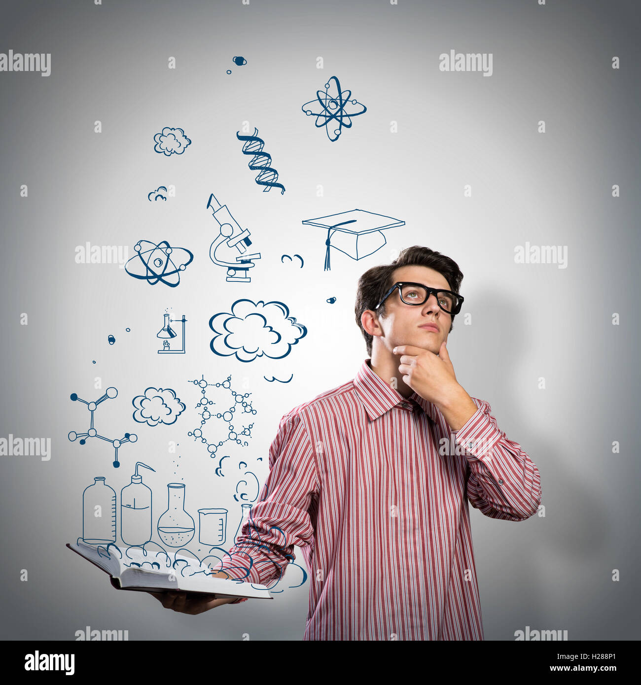 young scientist holding a book Stock Photo - Alamy