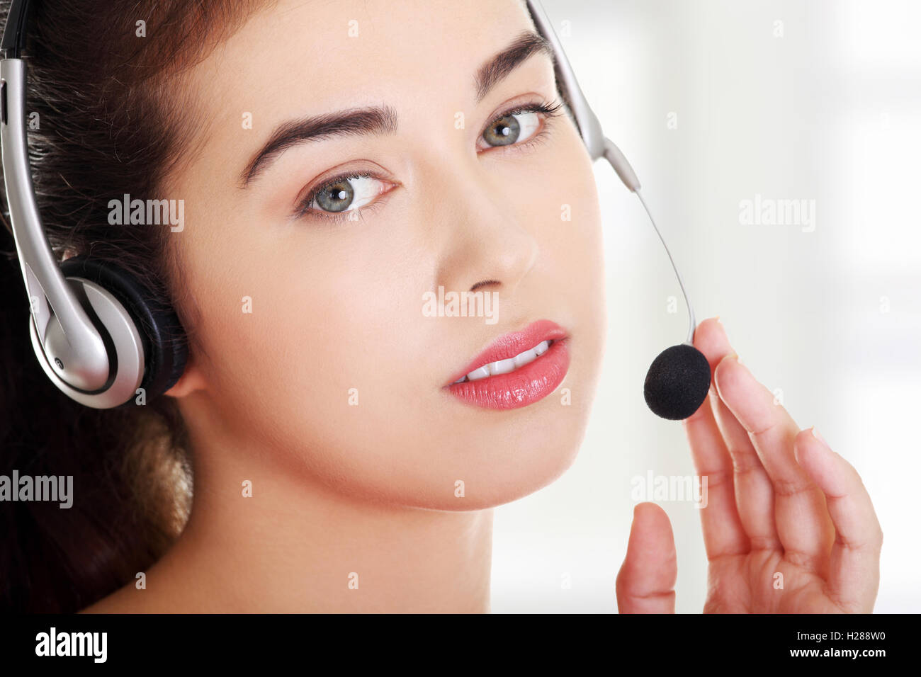 Call center woman with headset Stock Photo - Alamy