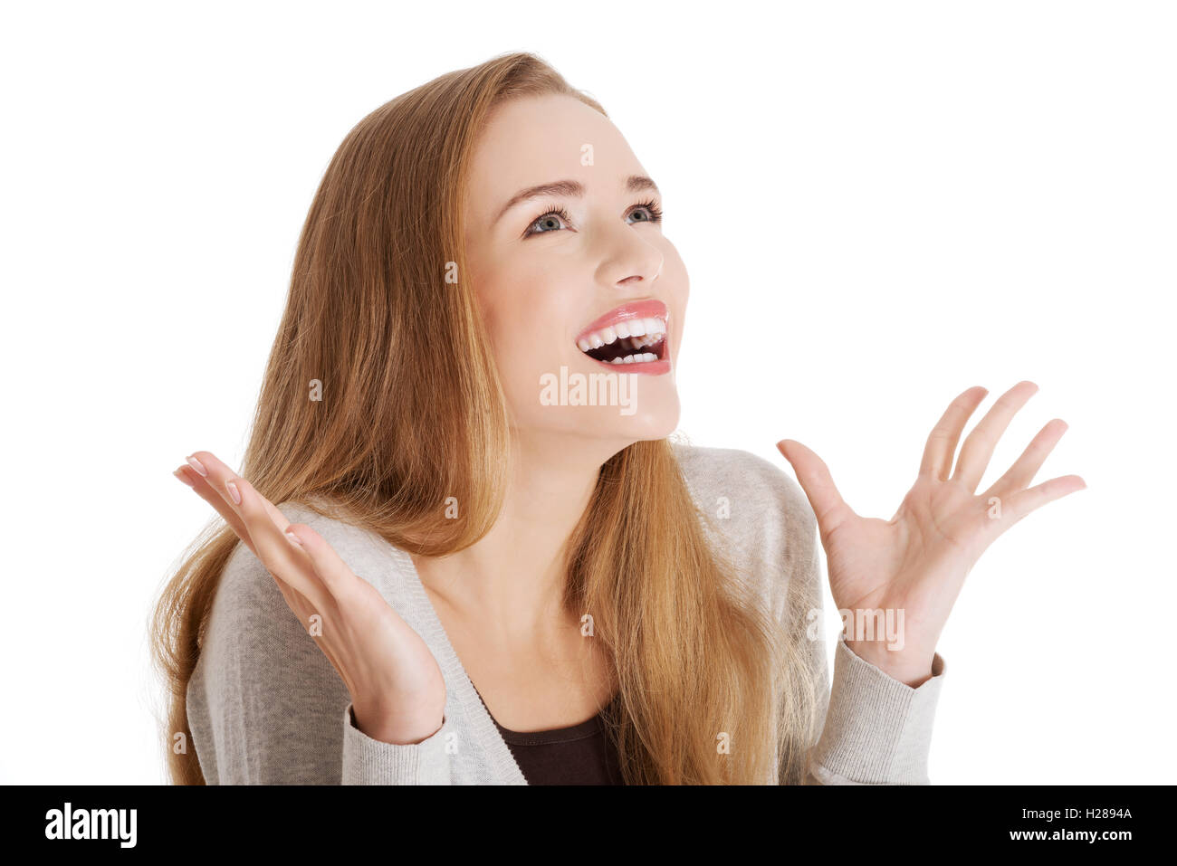 Beautiful positive and casual woman expressing surprise Stock Photo - Alamy