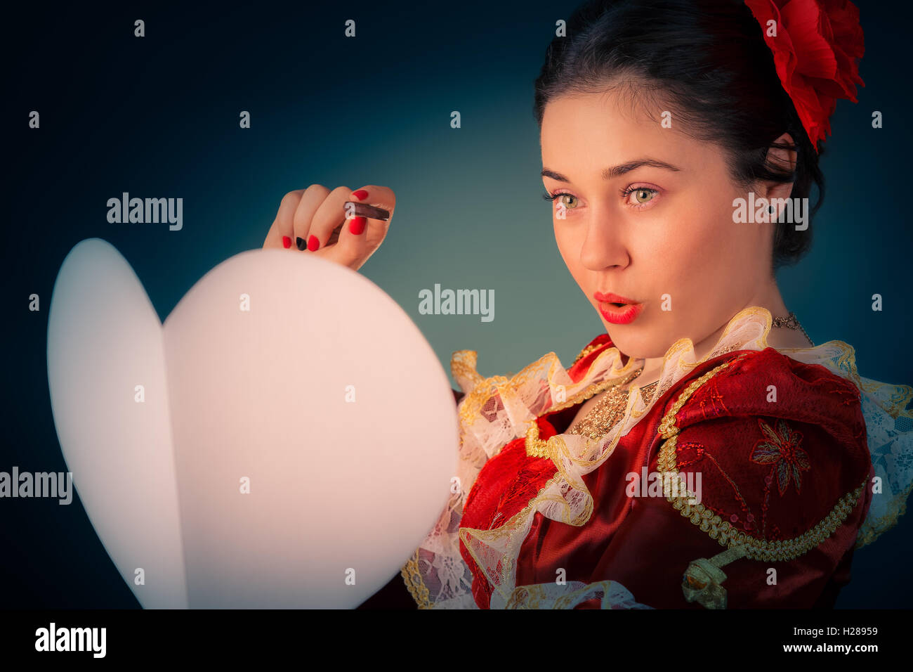 Surprised Princess with Heart Shaped Card Stock Photo - Alamy