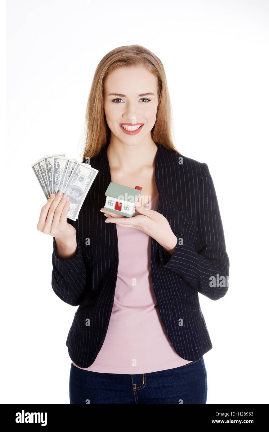 Beautiful business woman holding dollar currency and house Stock Photo ...