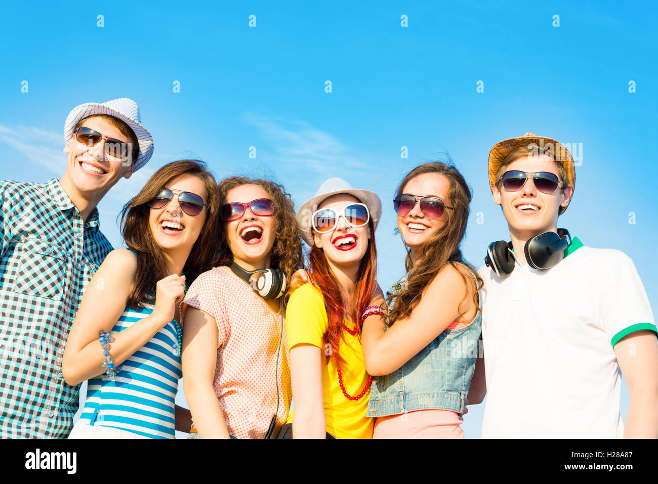 group of young people wearing sunglasses and hat Stock Photo - Alamy