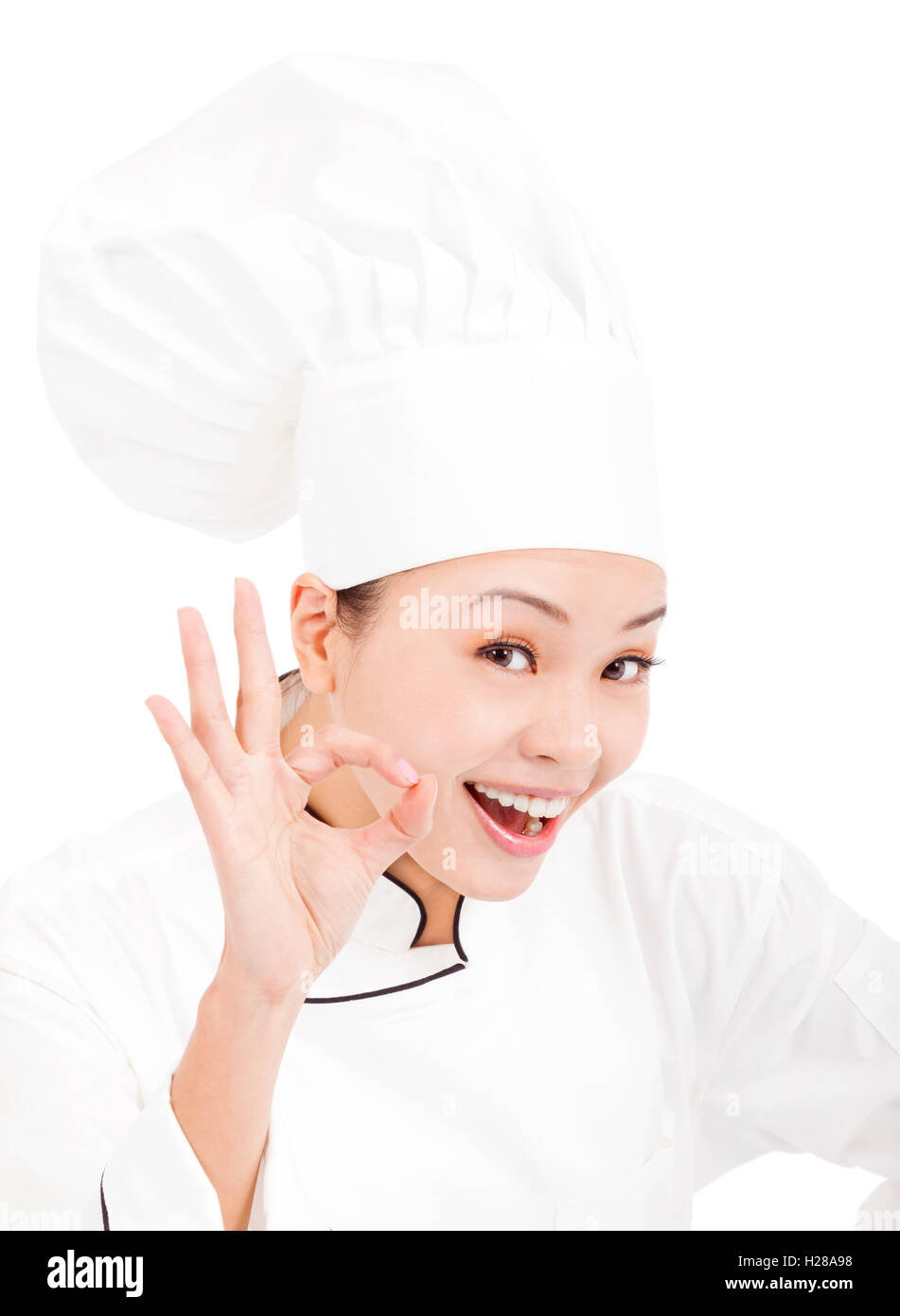 Pretty woman chef baker or cook showing ok hand sign Stock Photo - Alamy