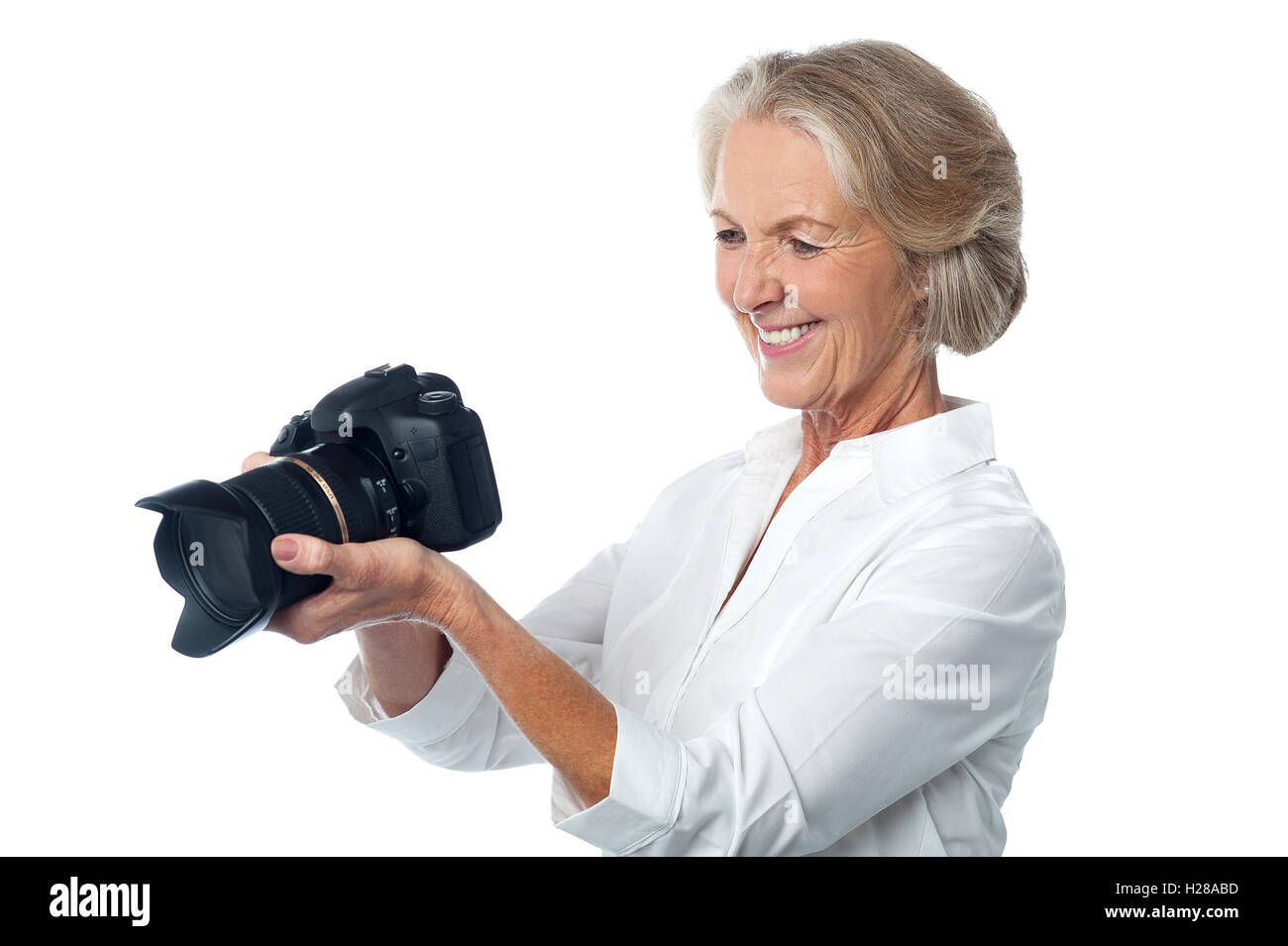 Experienced female photographer with camera Stock Photo - Alamy