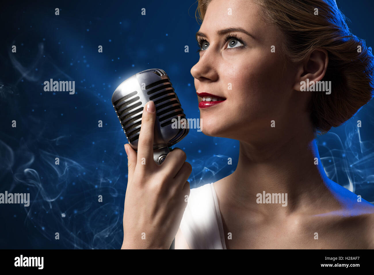attractive female singer with microphone Stock Photo - Alamy
