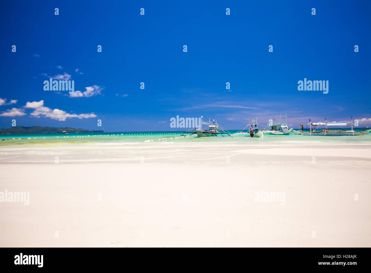 Perfect tropical beach with turquoise water and sailboats Stock Photo ...