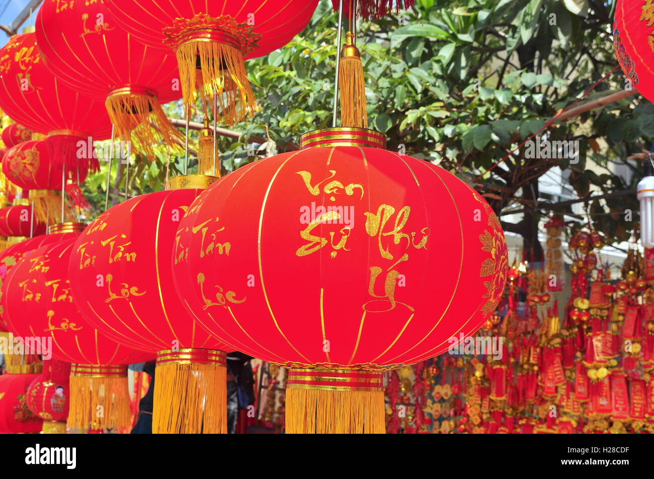 Nha Trang, Vietnam - February 7, 2016: Red lanterns and lucky items are ...