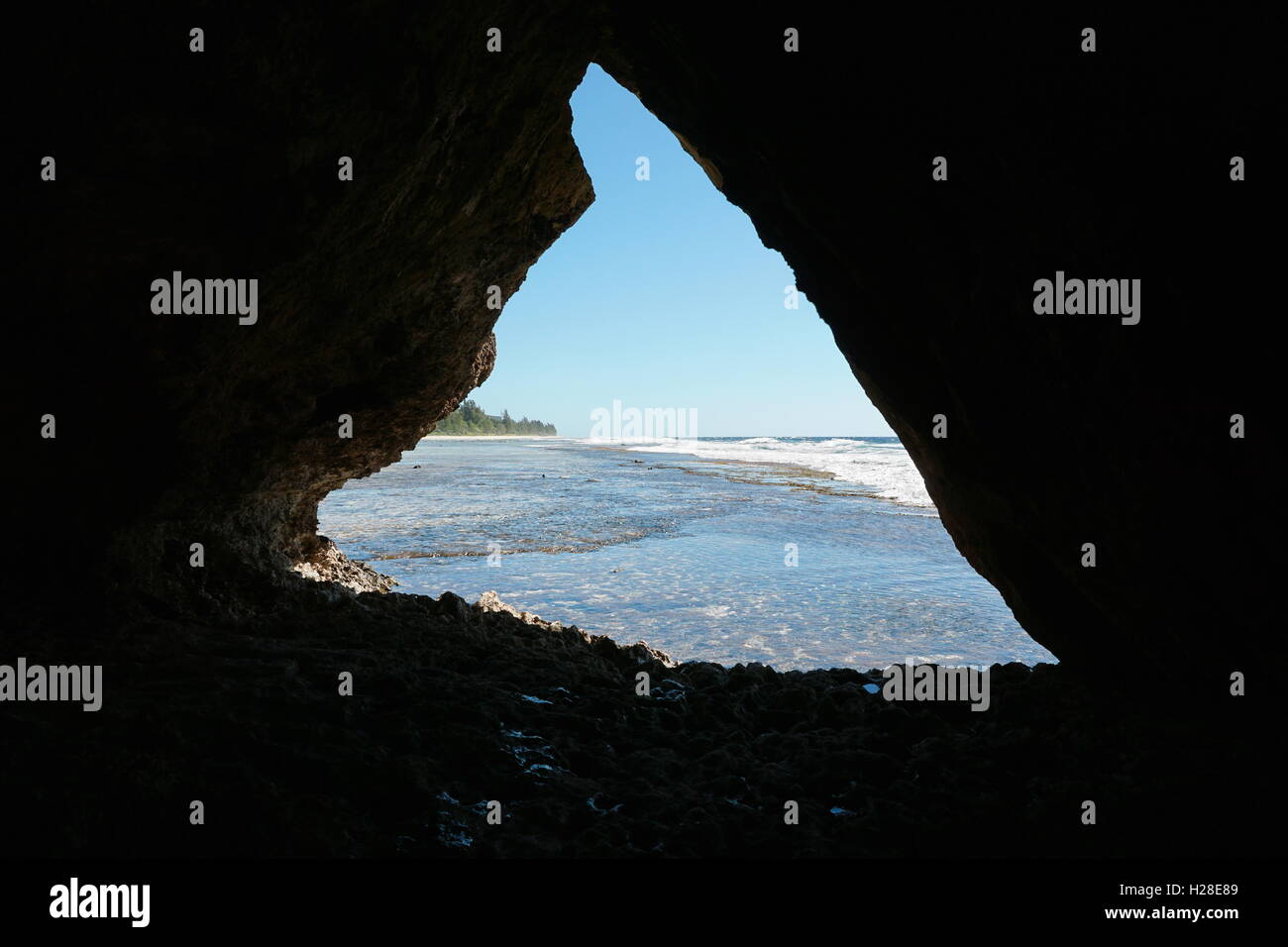 Sea shore seen from a small cave in the rocks, Rurutu island, Pacific ...