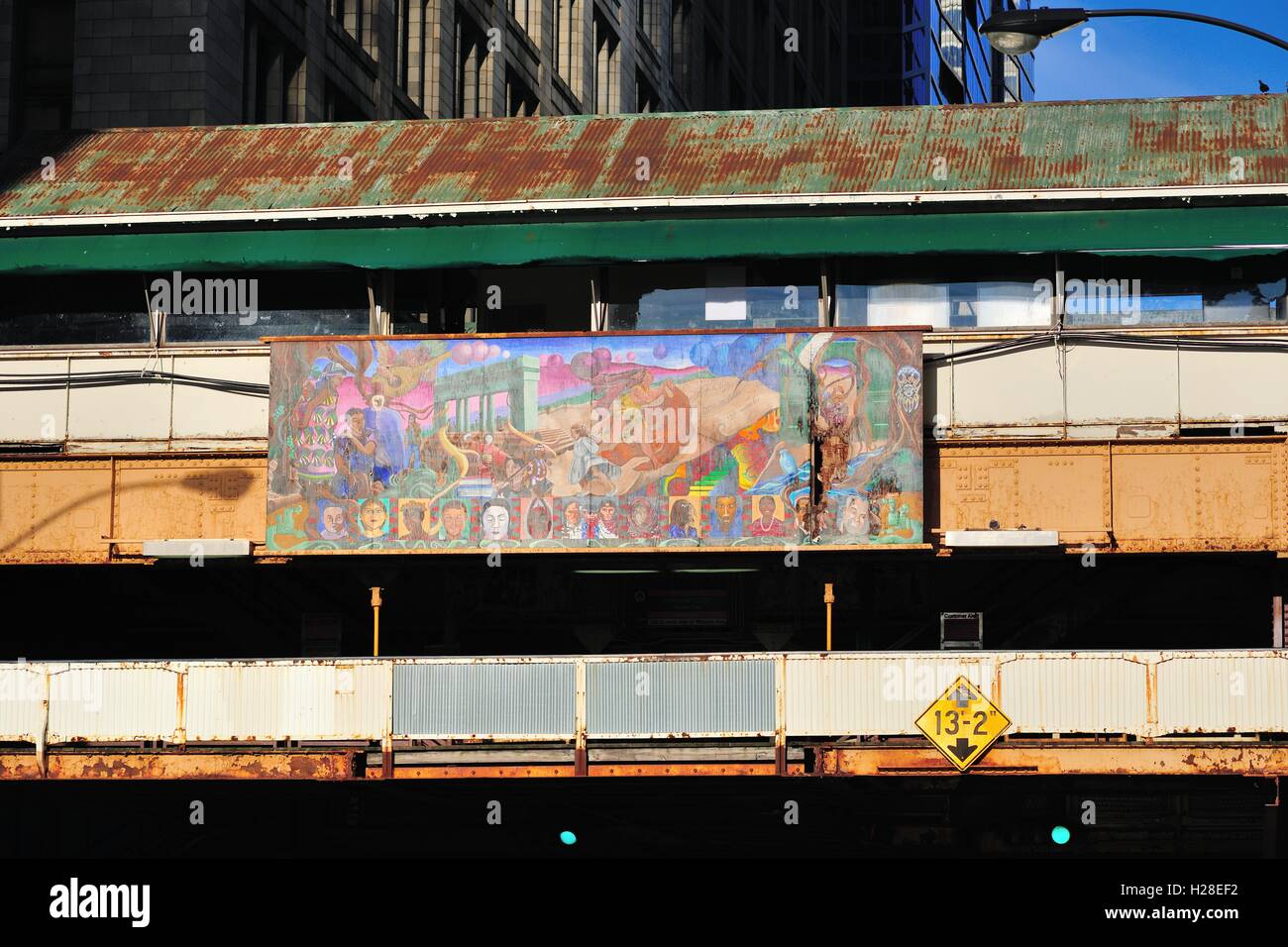 An aging mural displayed on the elevated station at the Chicago ...